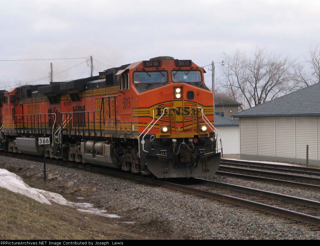 BNSF 5015 WB with empty grain train